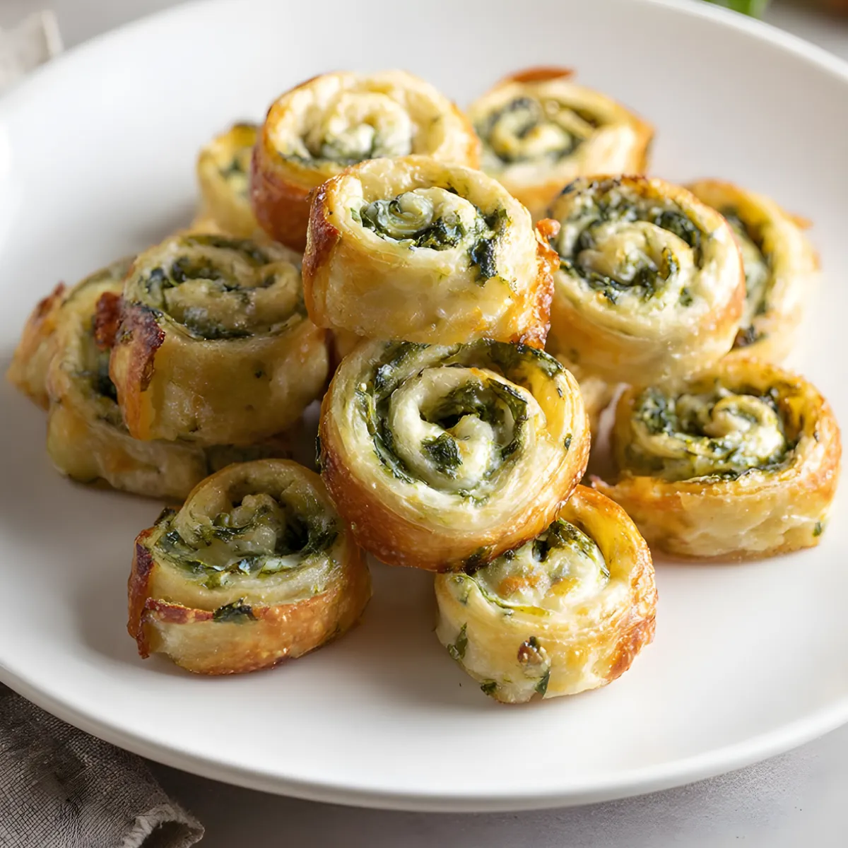 Spinach Dip in Bite-Sized Pinwheels - bakewithlina.com